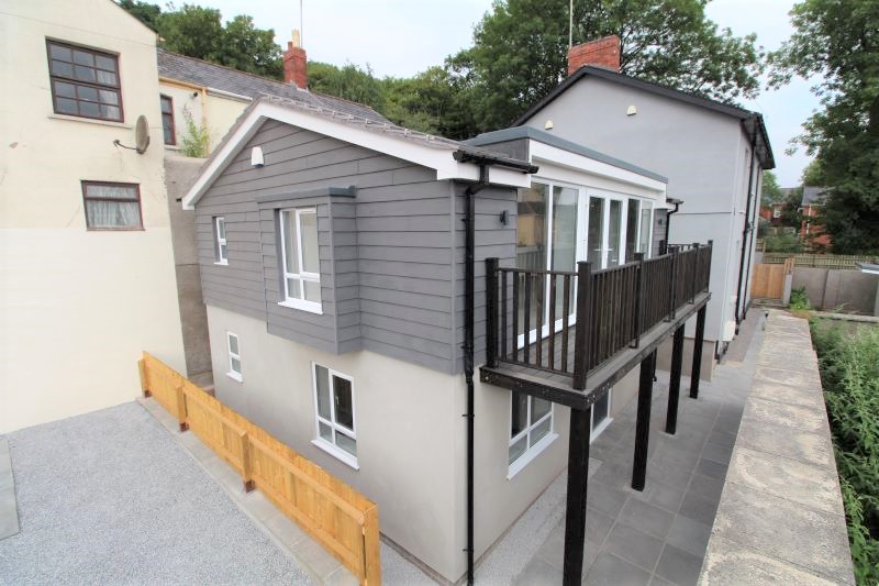 Two storey 'upside down house' with balcony, Newport - Signature: Sean ...